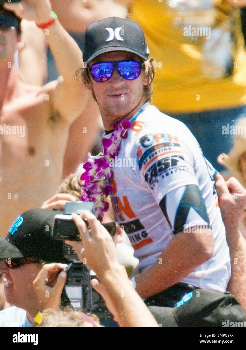 Huntington Beach native Brett Simpson flashes the peace sign as he is ...