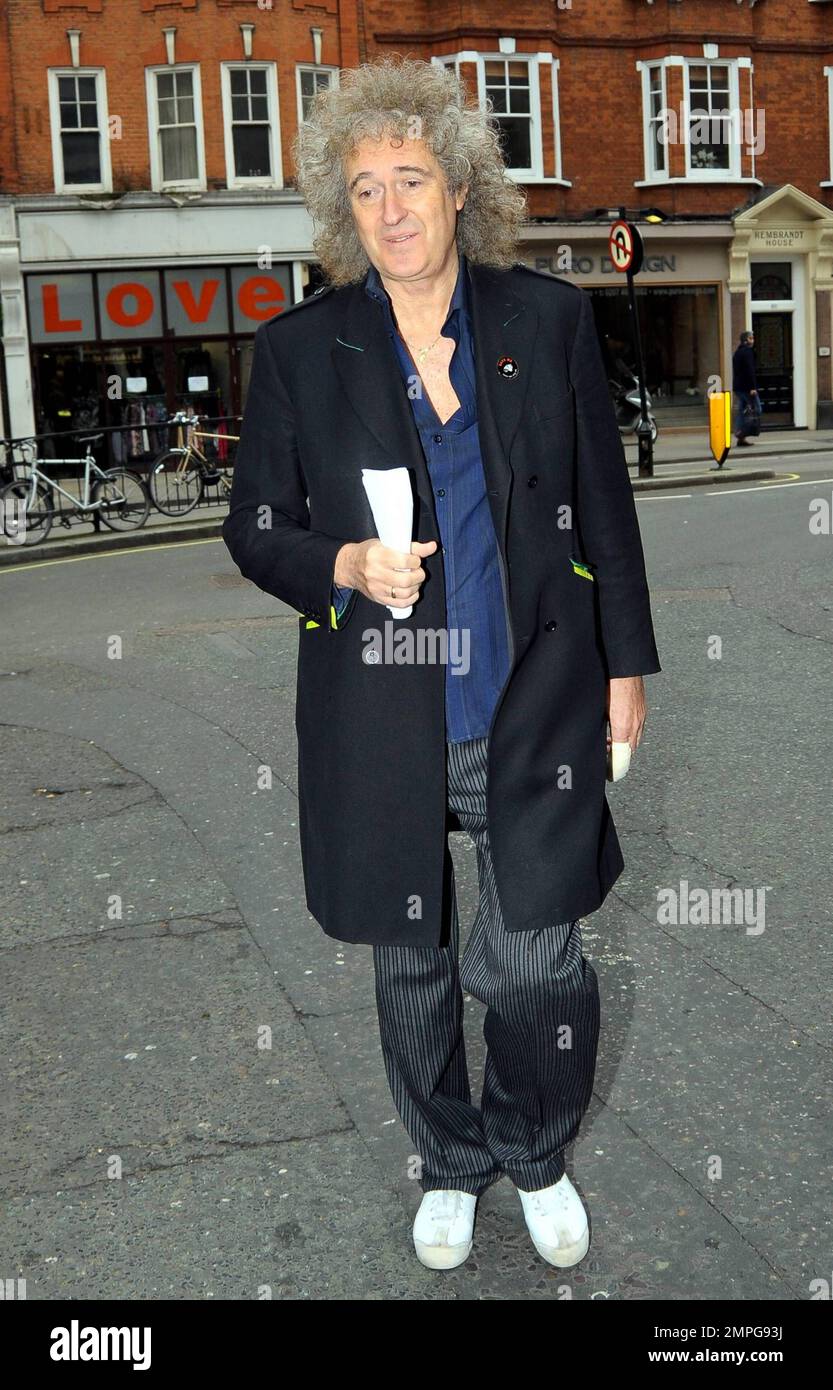 Queen guitarist Brian May sports a large bandage on one of his fingers ...