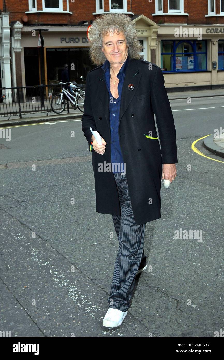 Queen guitarist Brian May sports a large bandage on one of his fingers ...