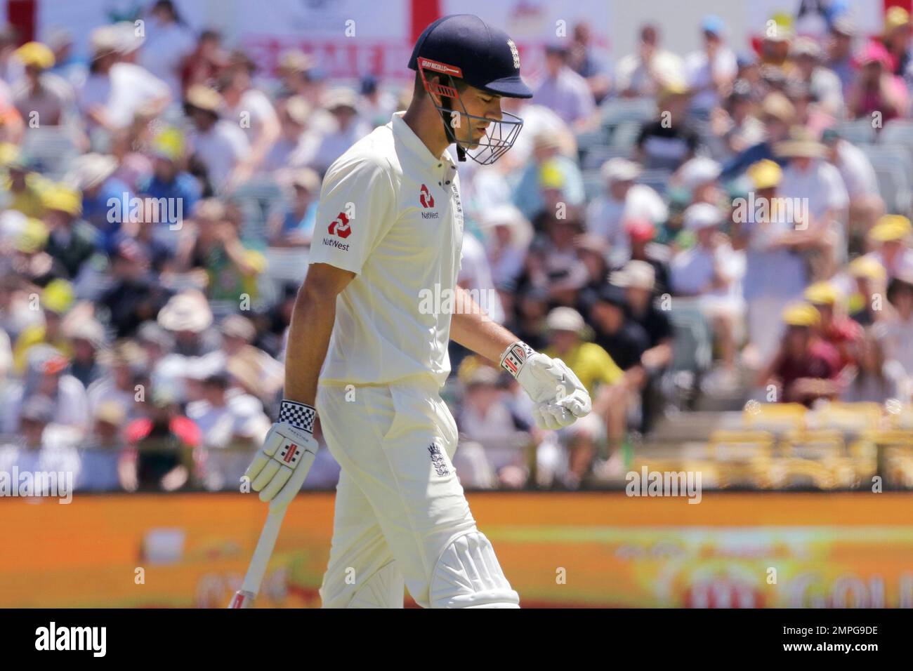 England's Alastair Cook walks off the ground after losing his wicket ...