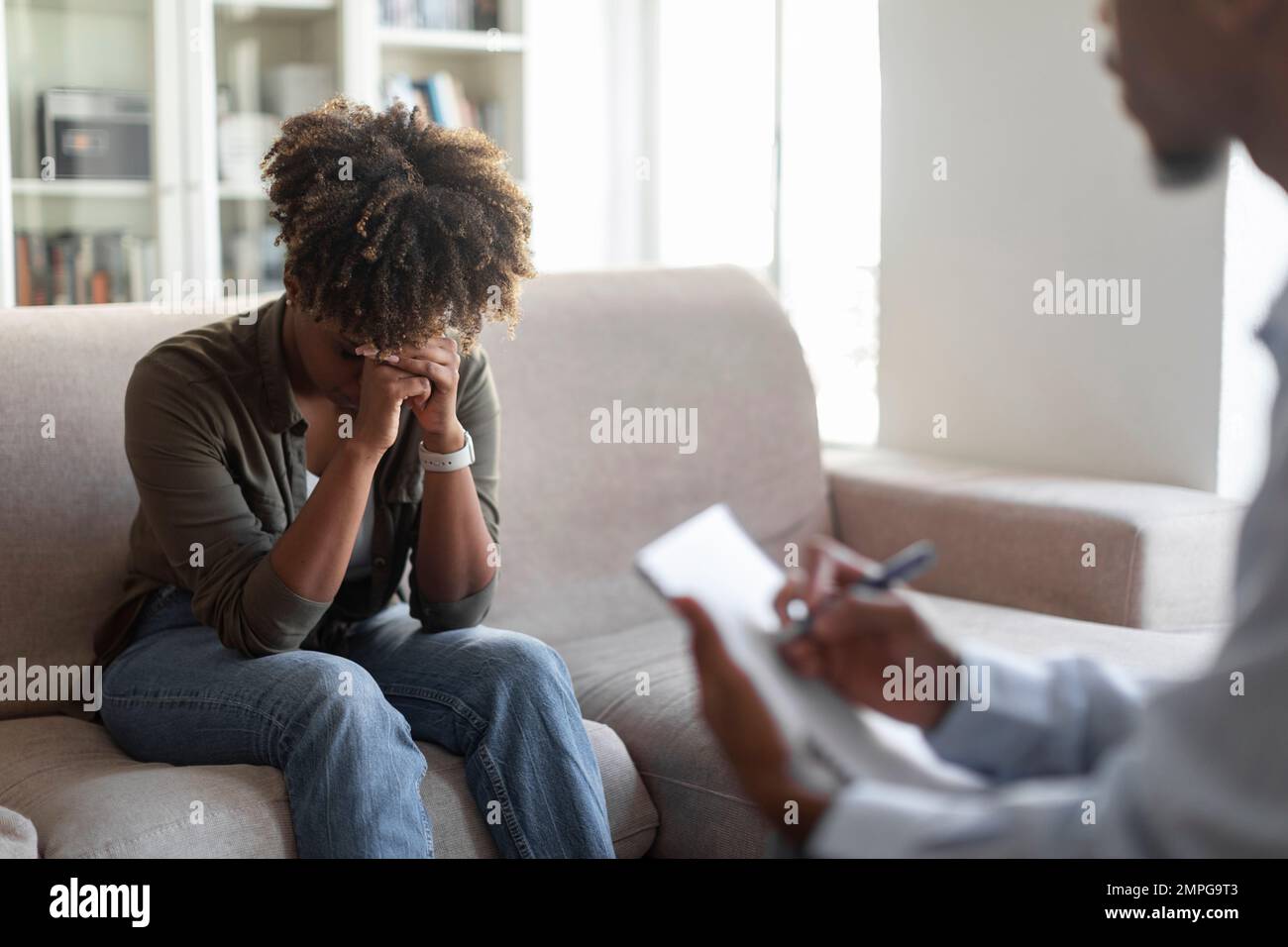 Black woman fighting addiction, visiting psychologist alone, copy space ...