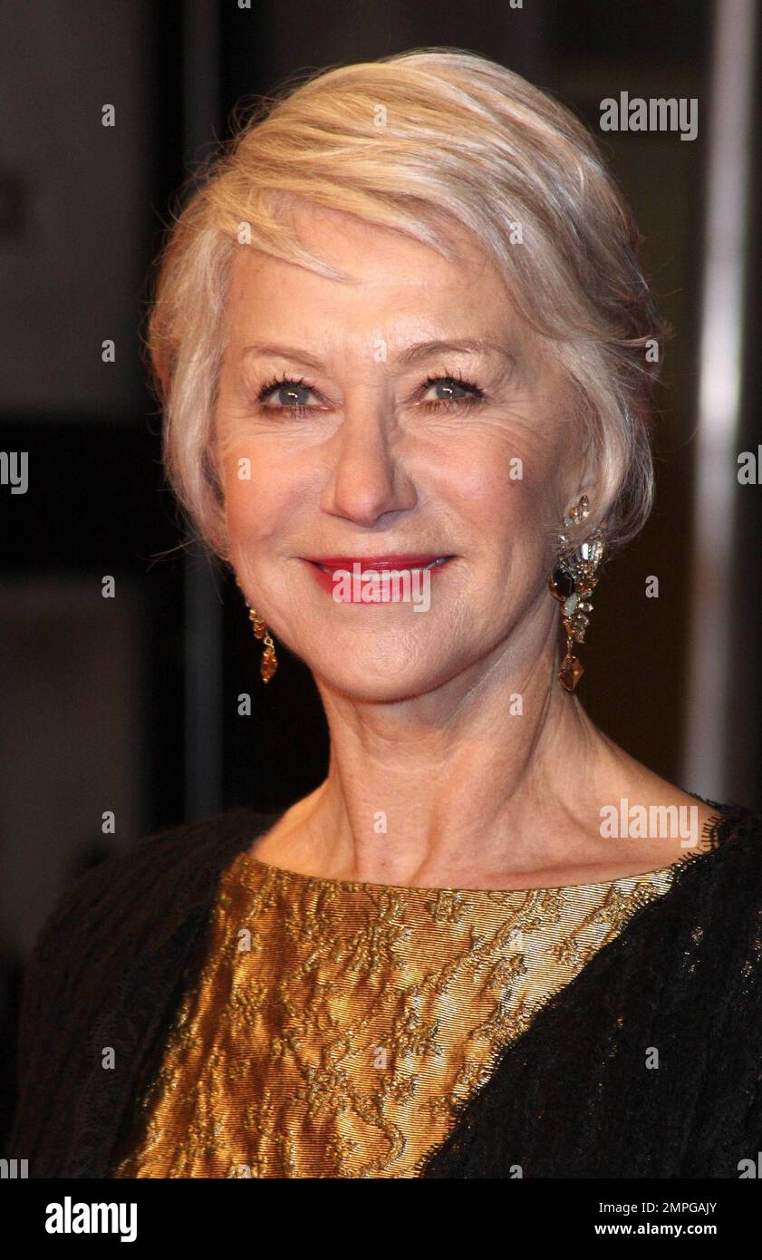 Decked out in a gold dress, gold gloves and sparkly gold high heels and ...