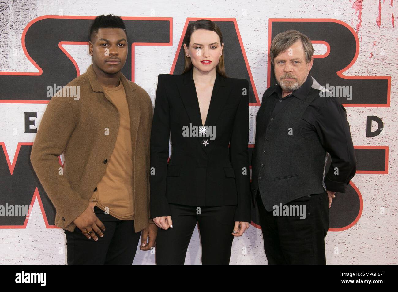 John Boyega, Daisy Ridley and Mark Hamill pose for photographers with ...