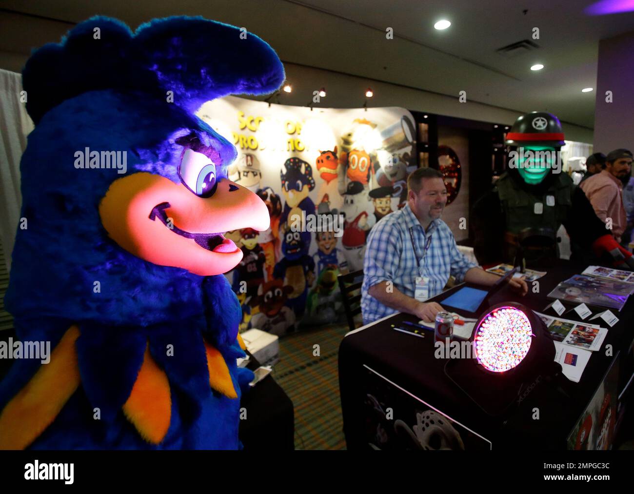 Rick Scollon of Scollon Mascots and Characters, Inc. works his booth at ...
