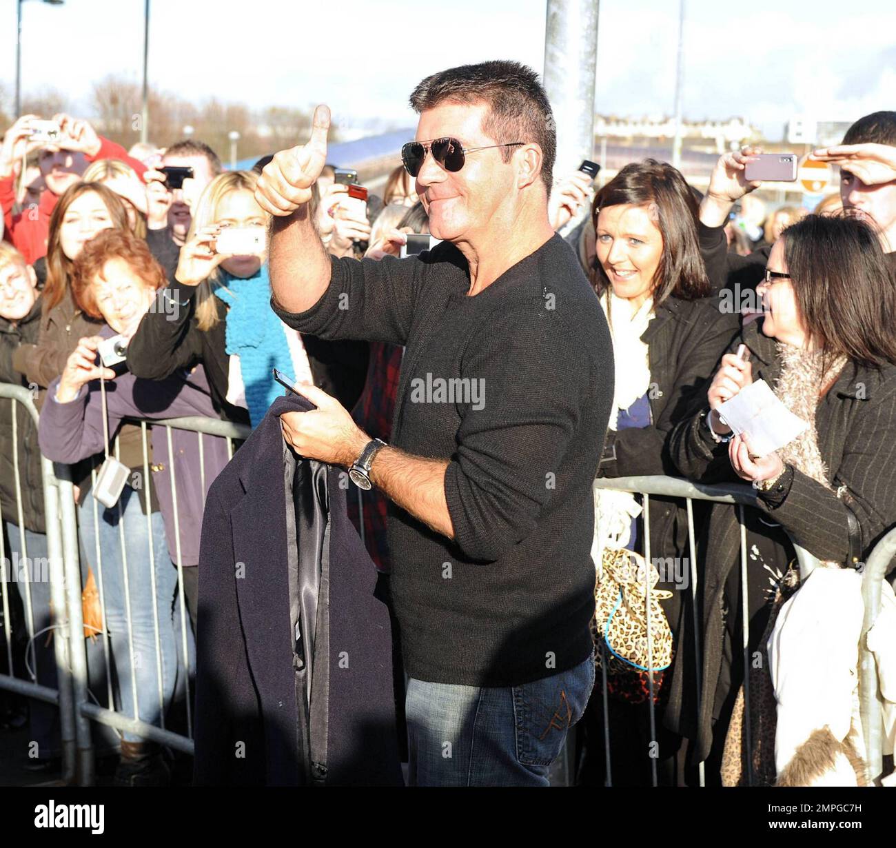 Judge Simon Cowell arrives and welcomes the crowds for Britain's got ...