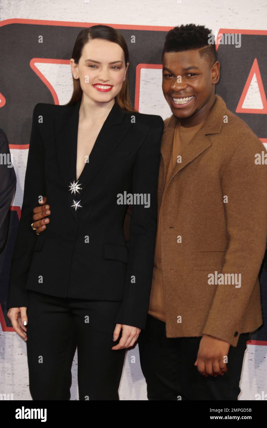 Daisy Ridley and John Bodega pose for photographers upon arrival at the ...
