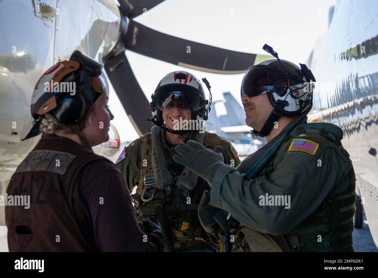 Rear Adm. Greg Huffman, center, commander, Carrier Strike Group (CSG ...