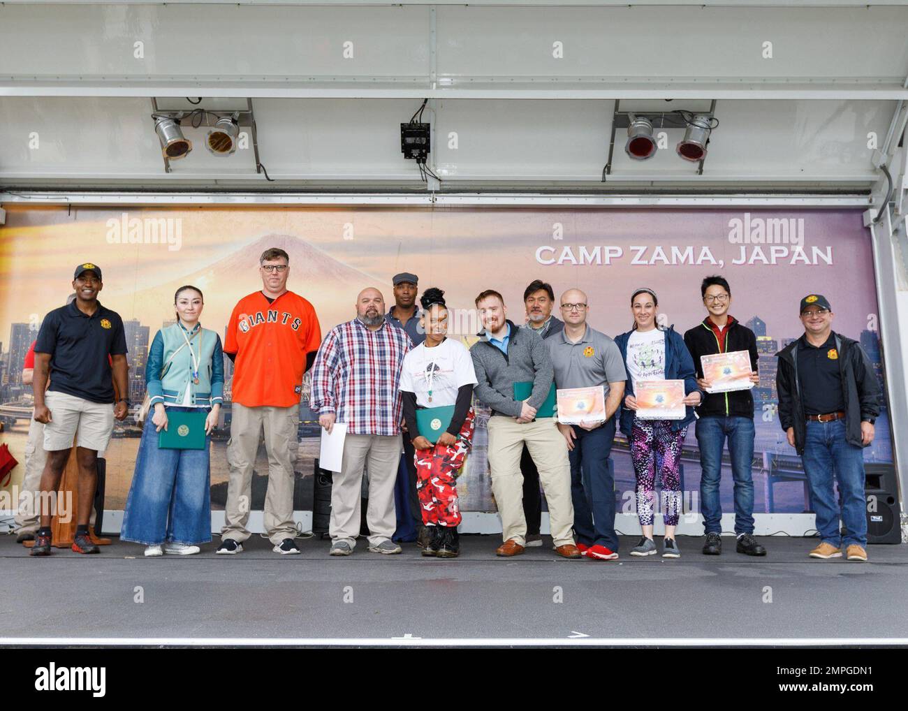 U.S. Army Garrison Commander Col. Christopher Tomlinson, far right, and ...