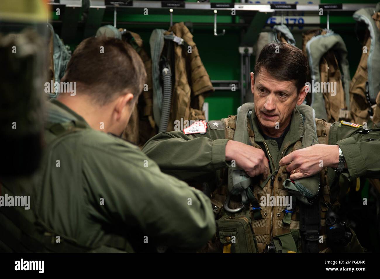 Rear Adm. Greg Huffman, right, commander, Carrier Strike Group (CSG) 12 ...