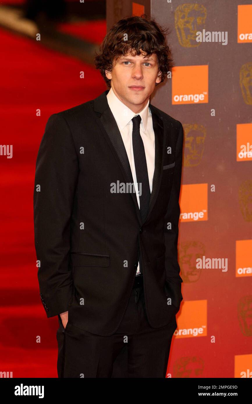 Jesse Eisenberg poses for photographers on the red carpet at the 2011 ...
