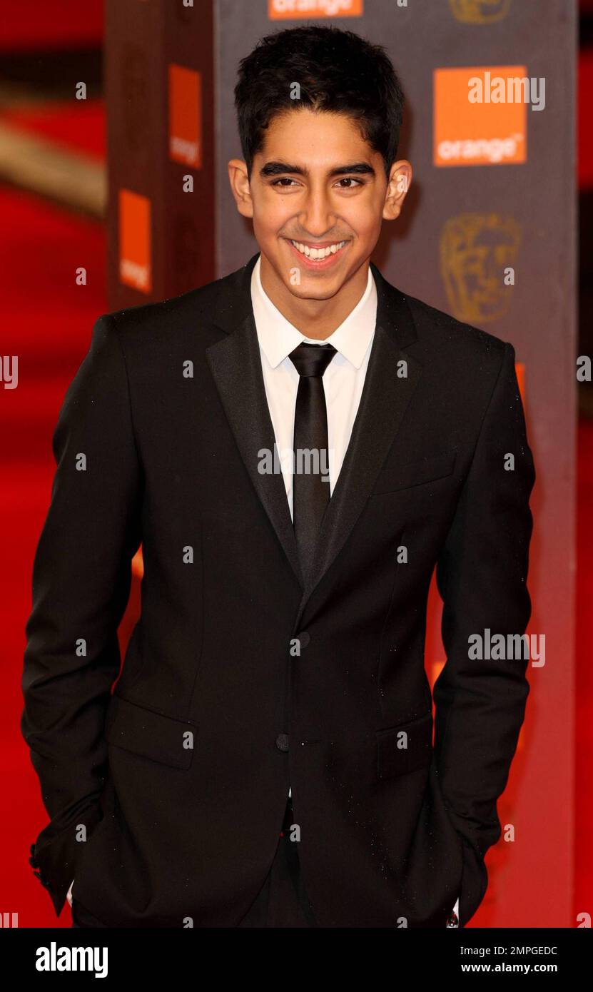 Dev Patel poses for photographers on the red carpet at the 2011 Orange ...