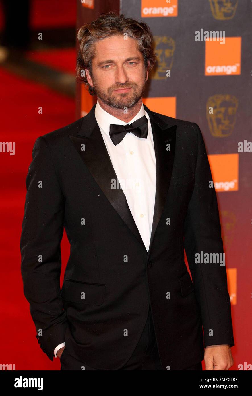Gerard Butler poses for photographers on the red carpet at the 2011ange ...