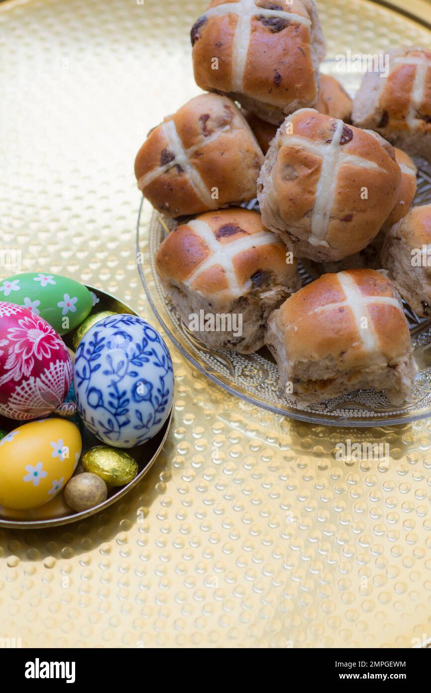 Easter table with hot cross buns and decorated eggs Stock Photo - Alamy