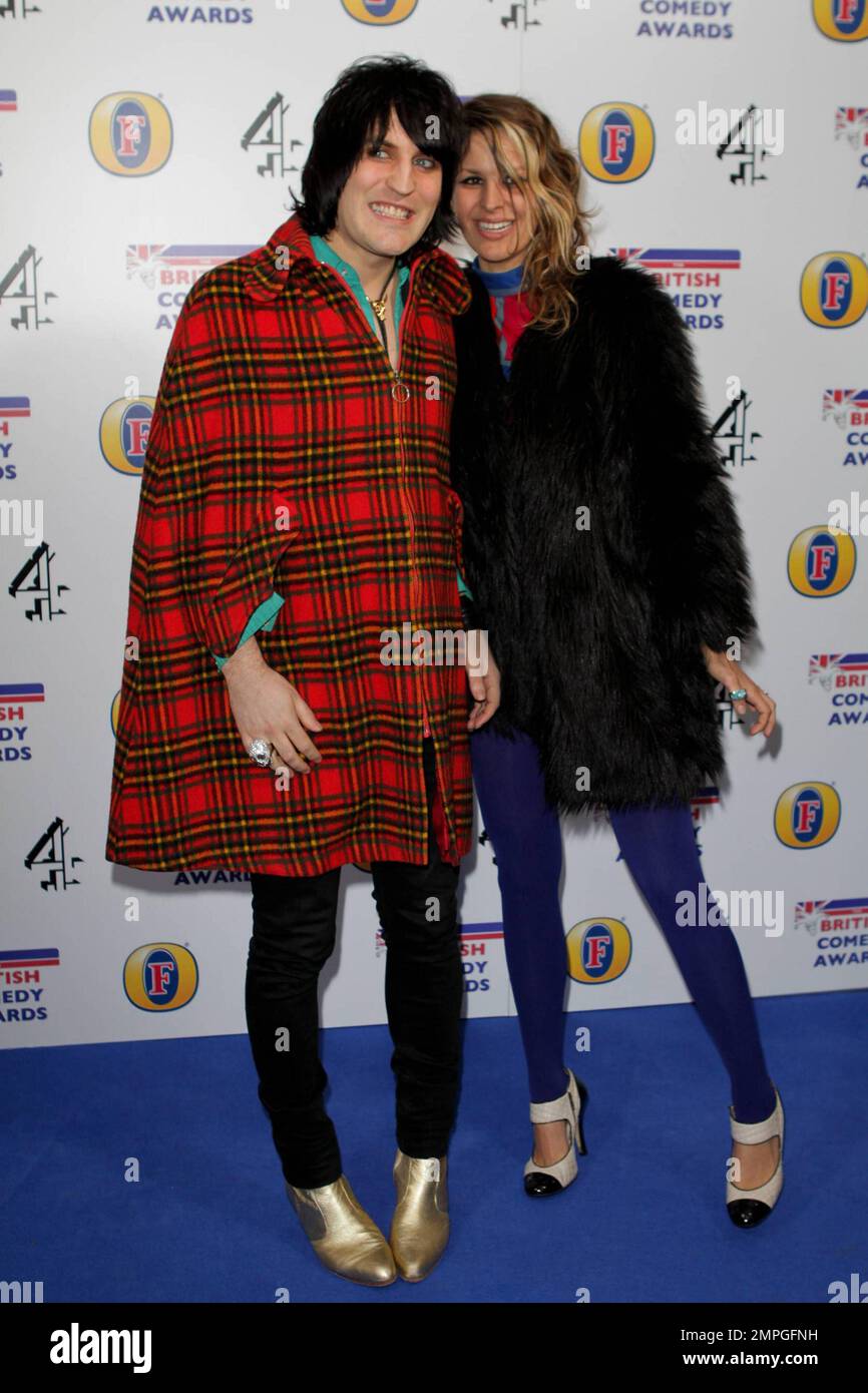 In a red plaid cape and gold boots Noel Fielding arrives at the British ...