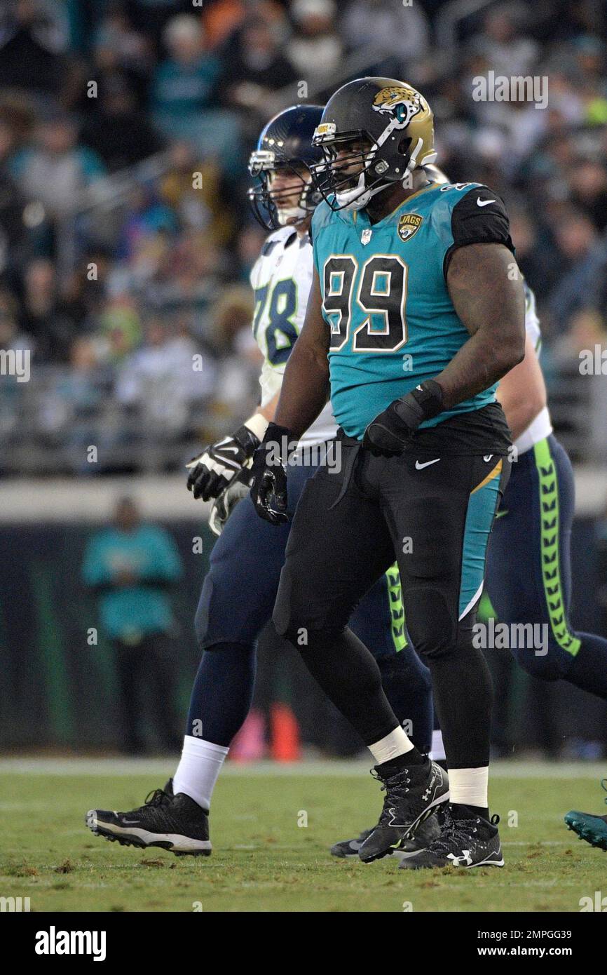 Jacksonville Jaguars defensive tackle Marcell Dareus (99) sets up for a ...