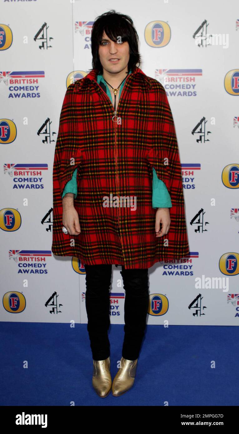 In a red plaid cape and gold boots Noel Fielding arrives at the British ...