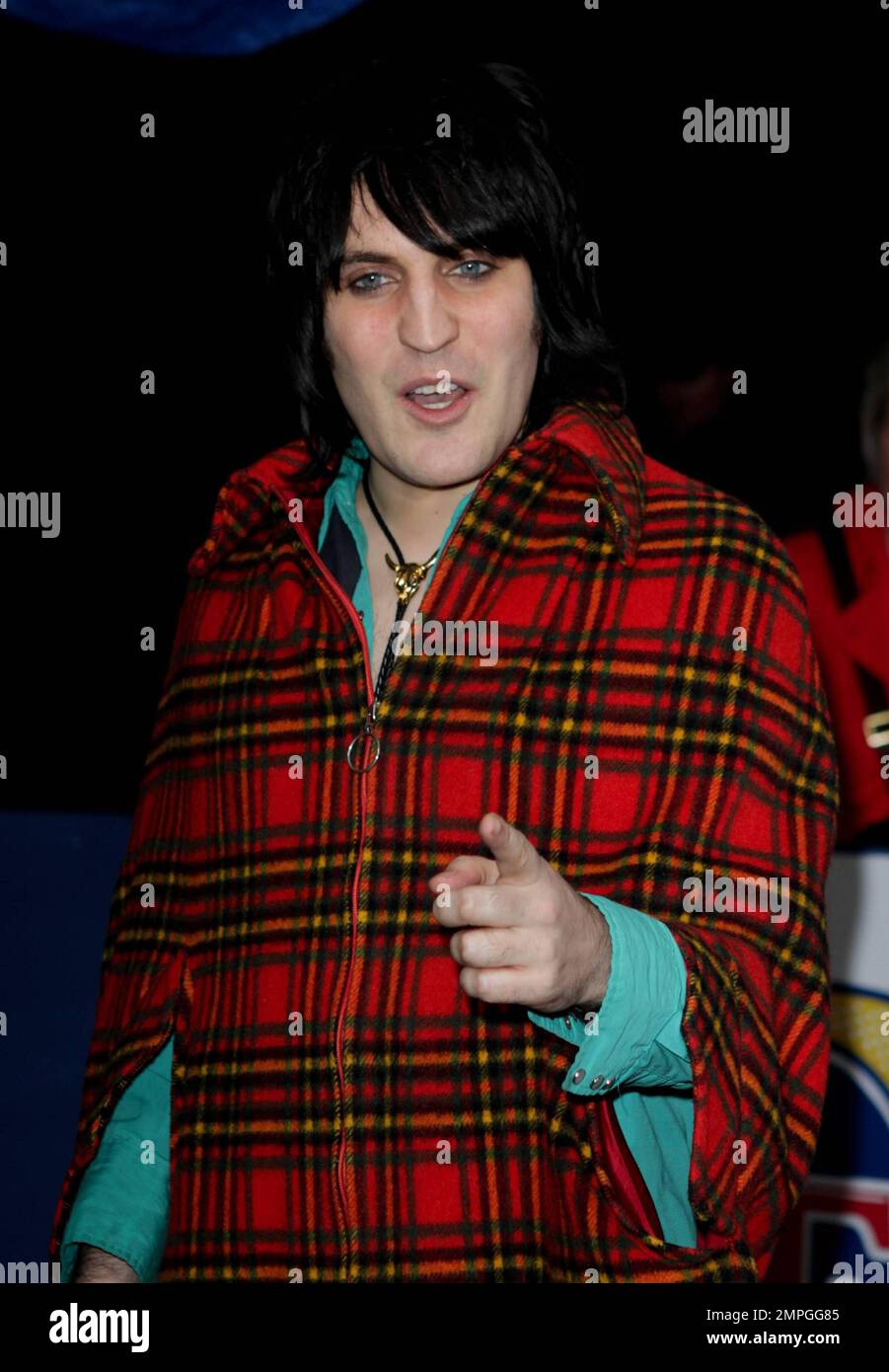 In a red plaid cape and gold boots Noel Fielding arrives at the British ...