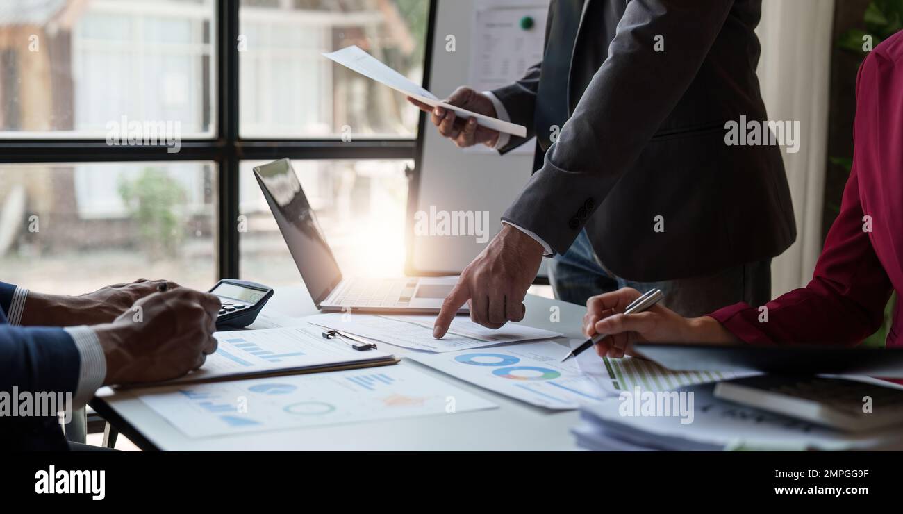 Close up of Diverse colleagues gather brainstorm discuss financial ...