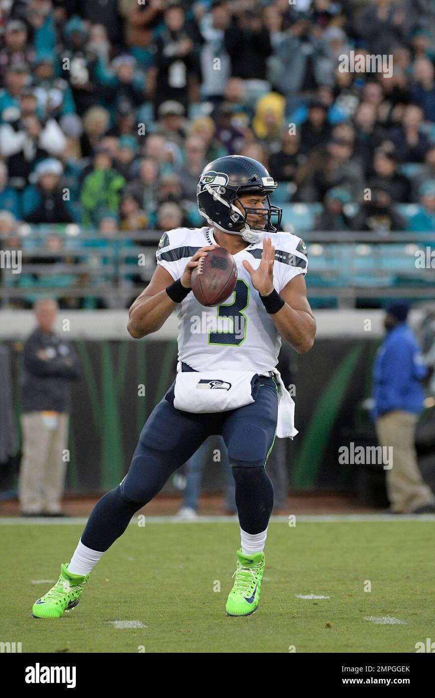 Seattle Seahawks quarterback Russell Wilson (3) sets up to throw a pass ...