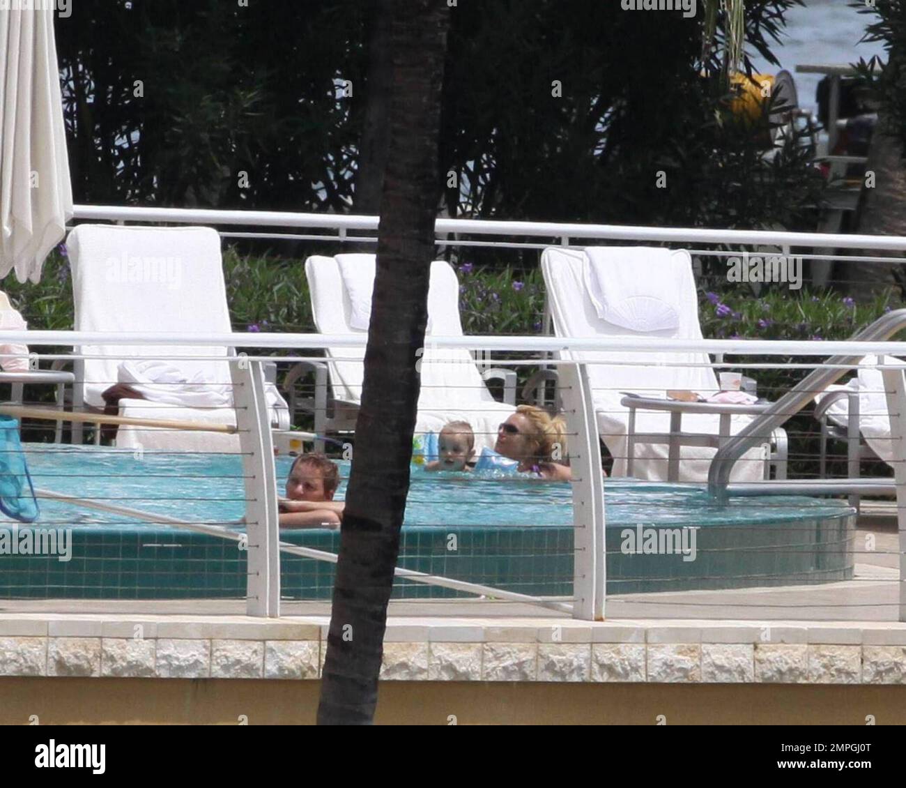 - Britney Spears spends the day with her family by the pool. Britney's ...