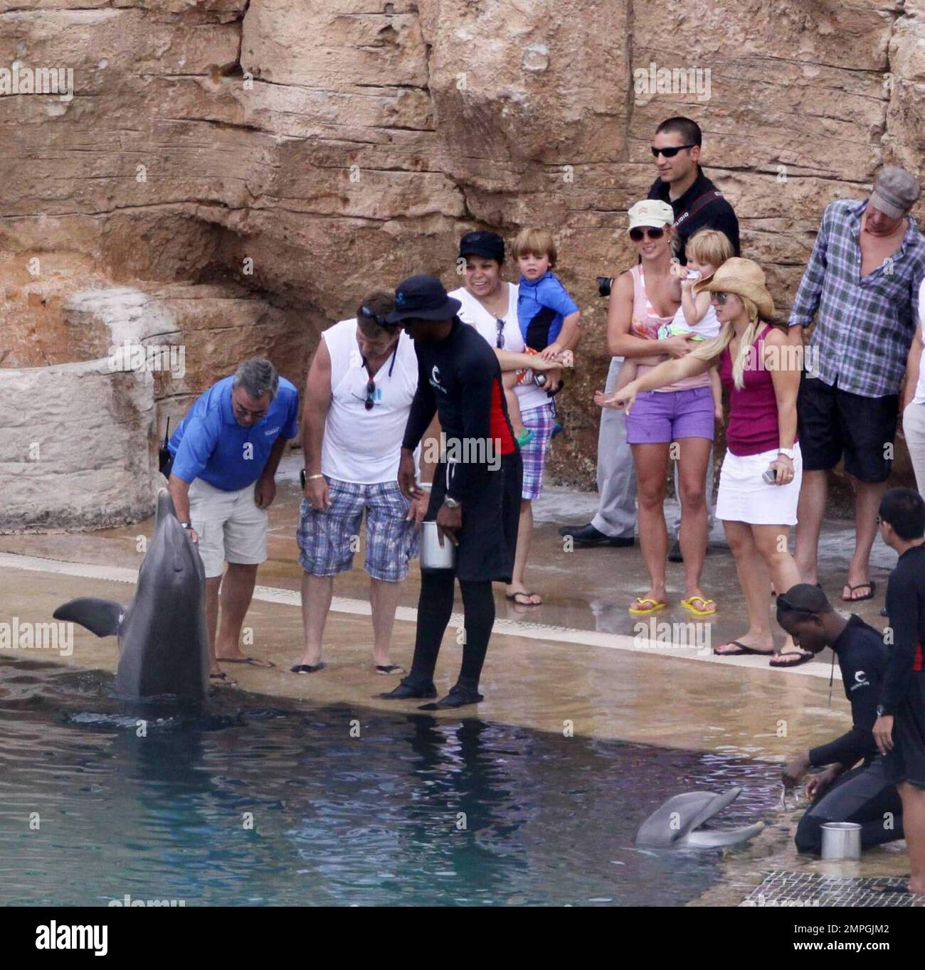 - Exclusive!! Popstar Britney Spears feeds the dolphins fish and takes ...