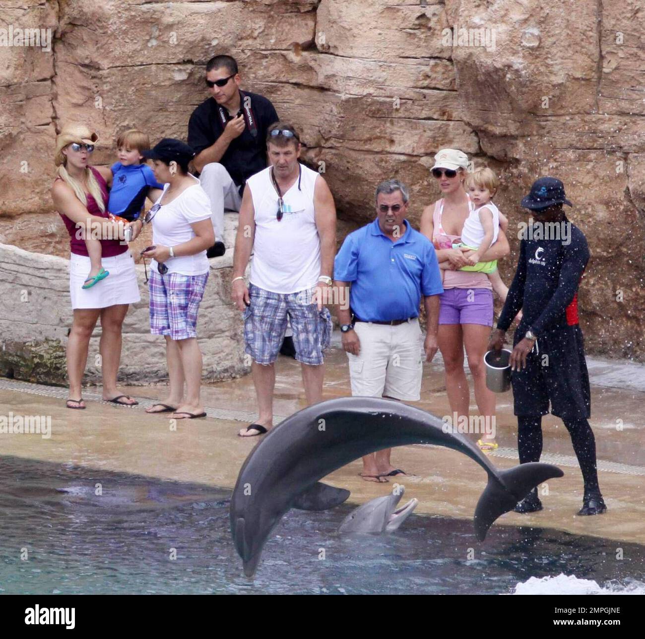 Exclusive!! Popstar Britney Spears feeds the dolphins fish and takes ...