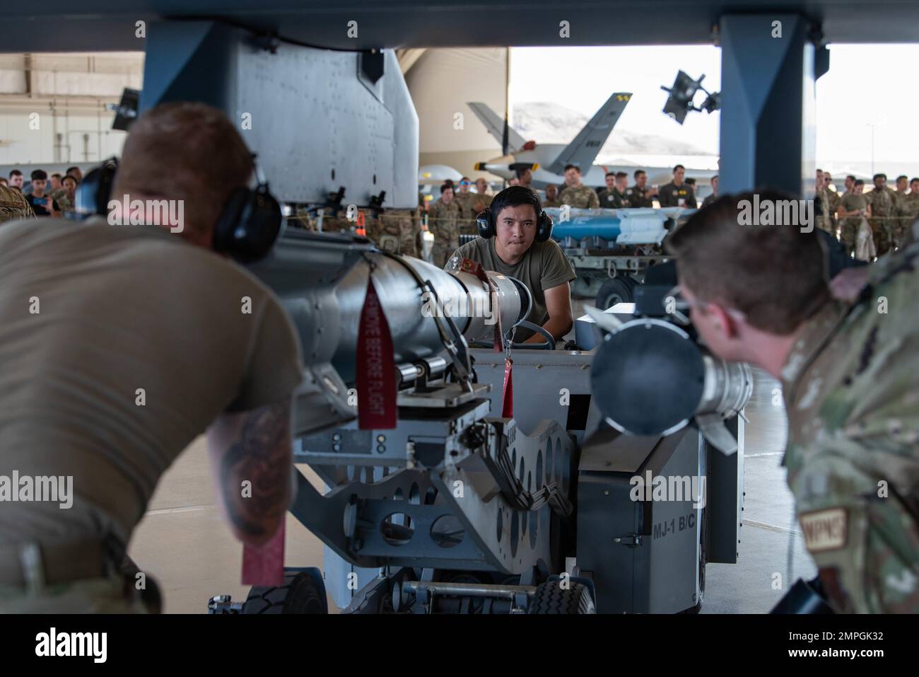 U.S. Air Force Airman 1st Class James, left, 432nd Aircraft Maintenance ...