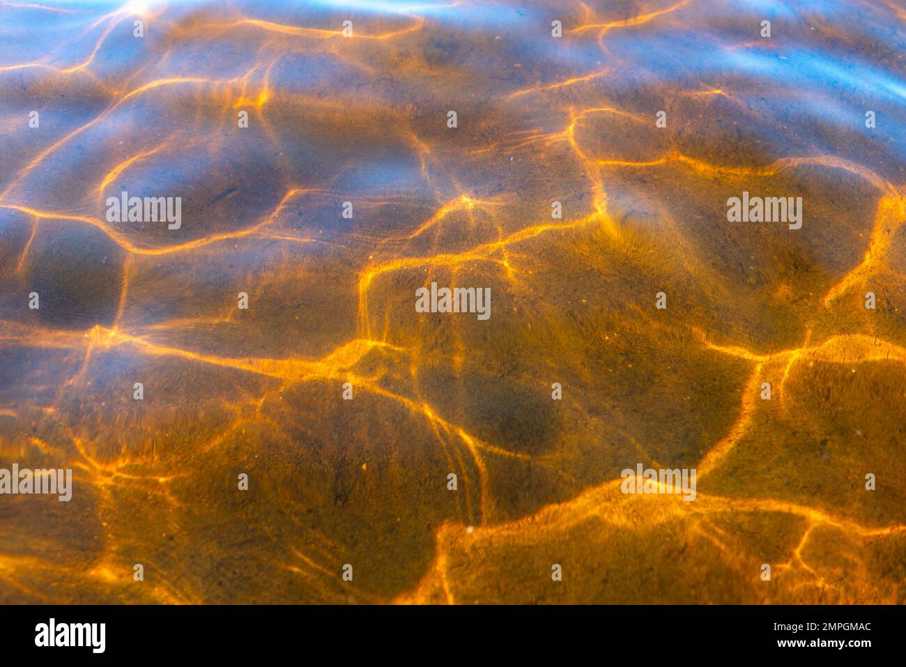 Bright reflection of the sun from the waves of clear clear water Stock ...