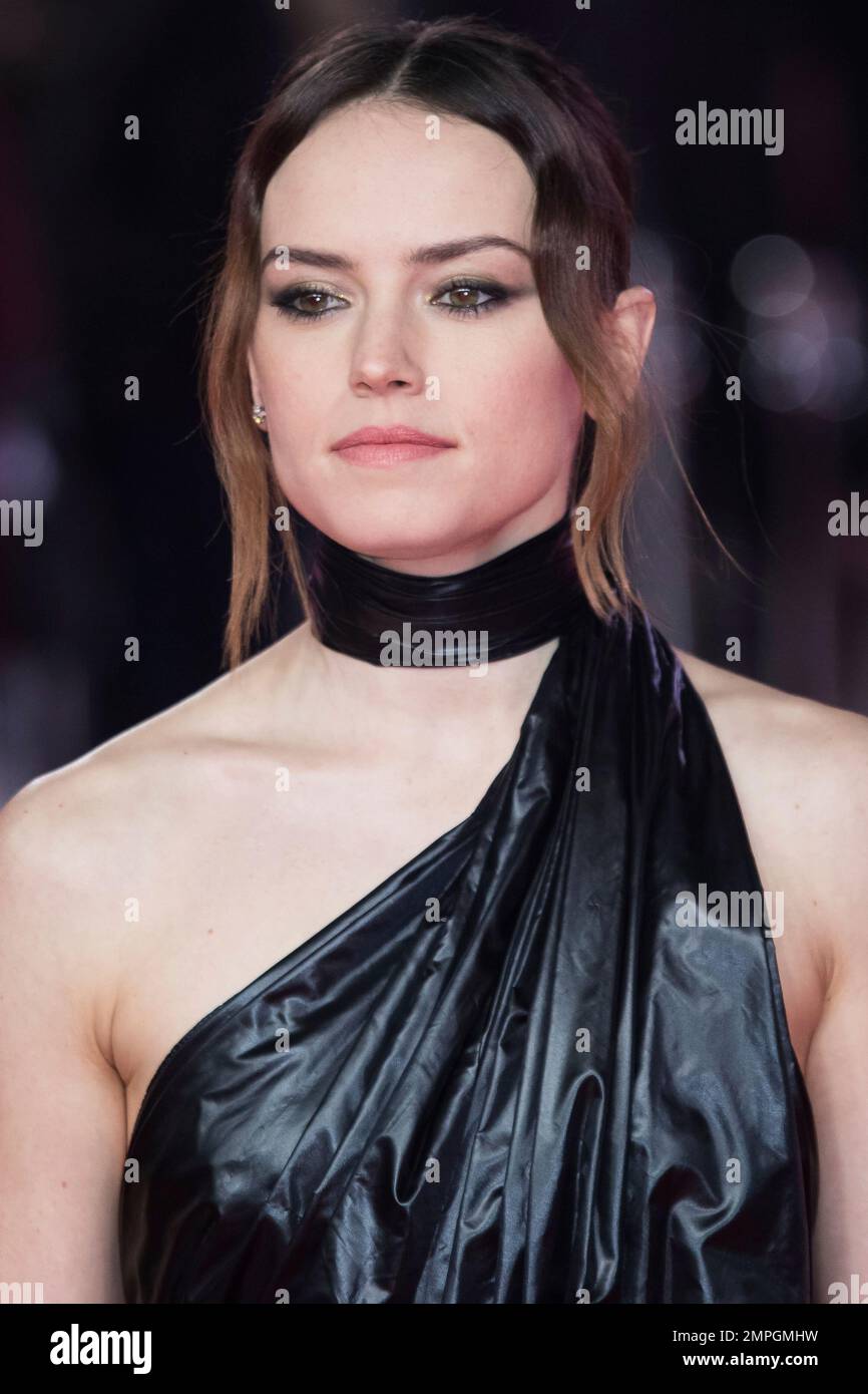 Actress Daisy Ridley poses for photographers upon arrival at the ...