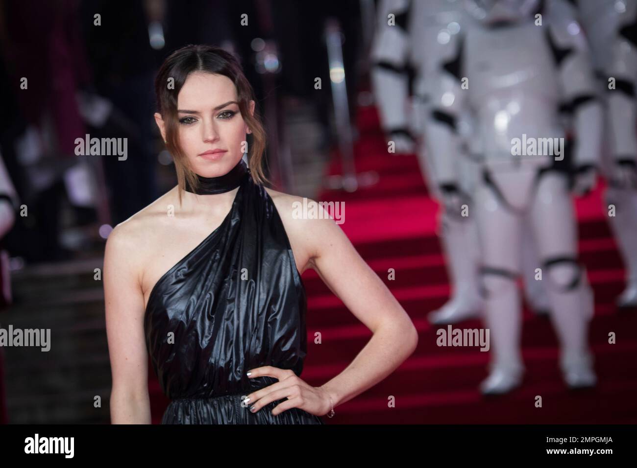 Actress Daisy Ridley poses for photographers upon arrival at the ...