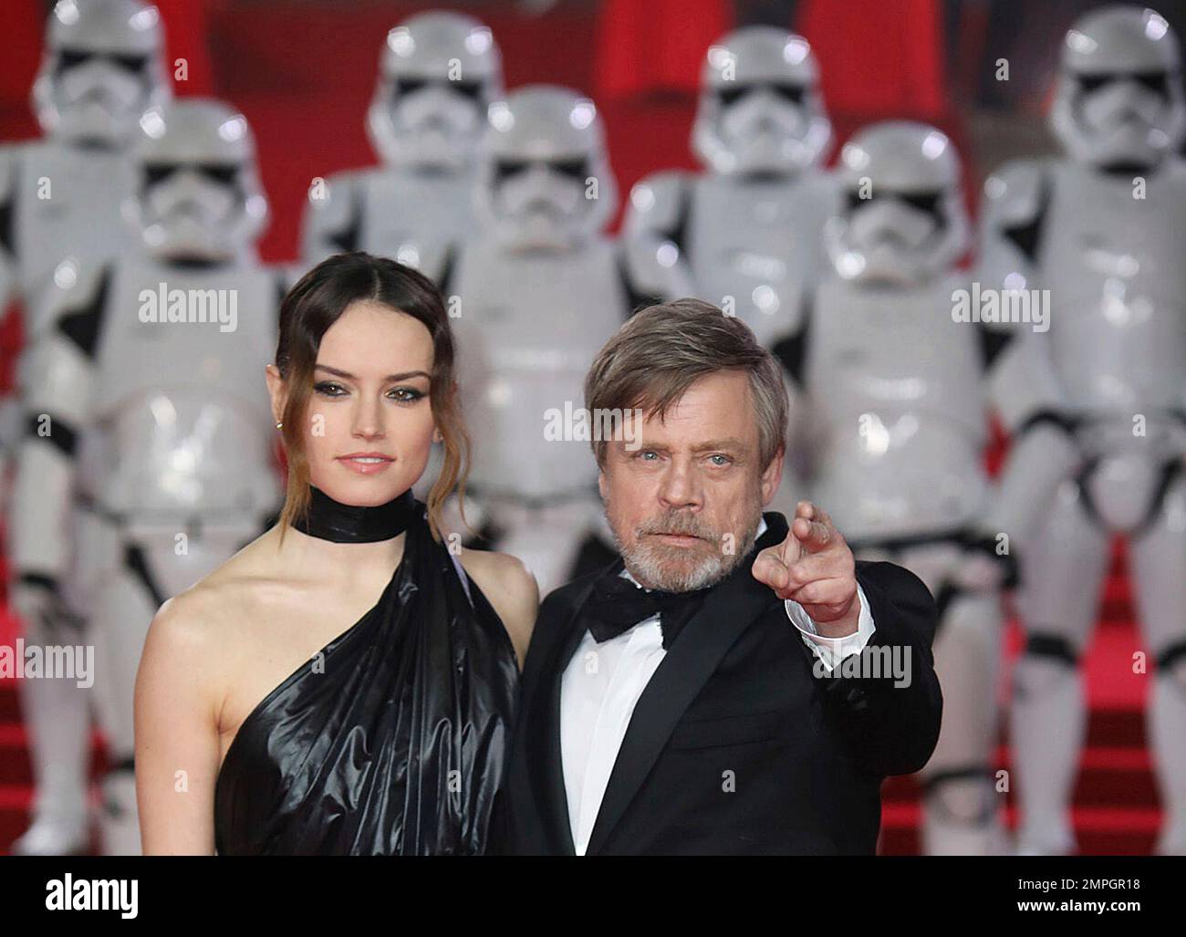 Actors Daisy Ridley, left, and Mark Hamill pose for photographers upon ...