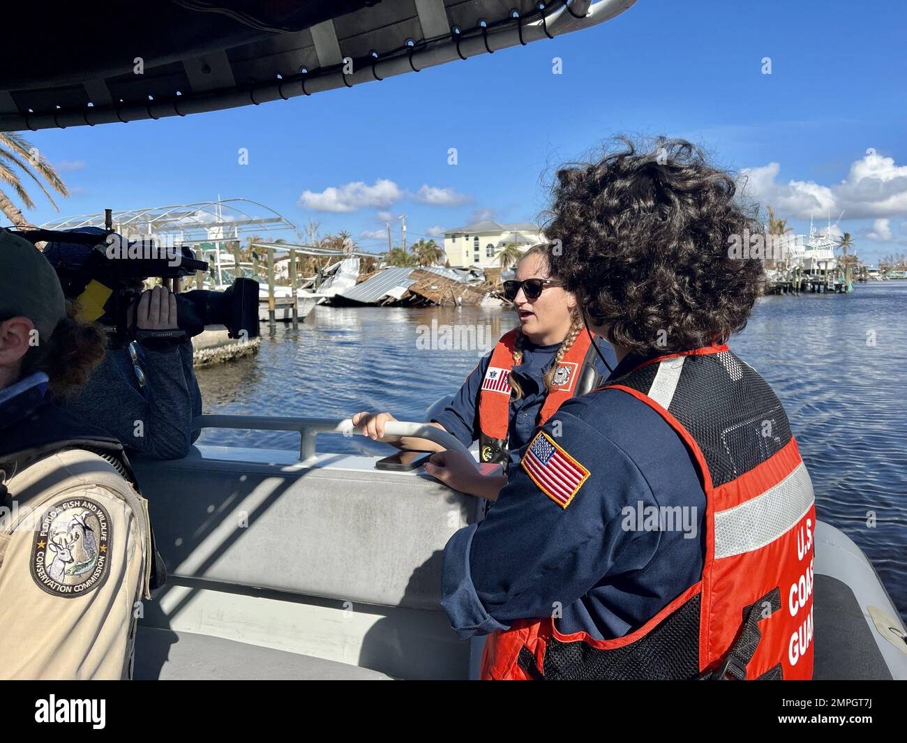 U.S. Coast Guard members conduct an interview with The Weather Channel ...