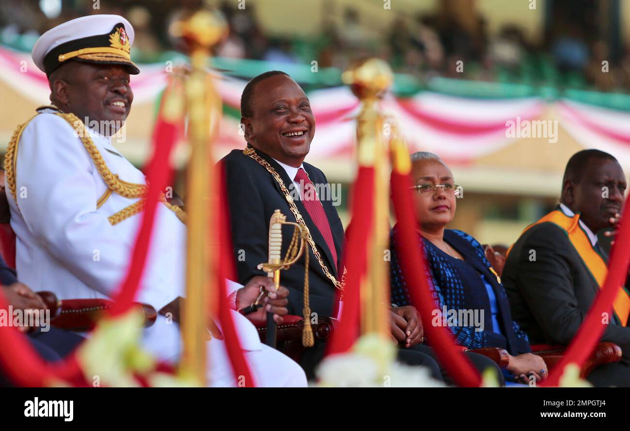 Kenya's President Uhuru Kenyatta, center, his wife Margaret, center-right, and Deputy President ...