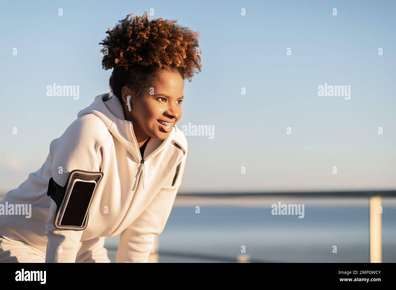 Portrait Of Tired Black Female Jogger Taking Breath While Jogging ...