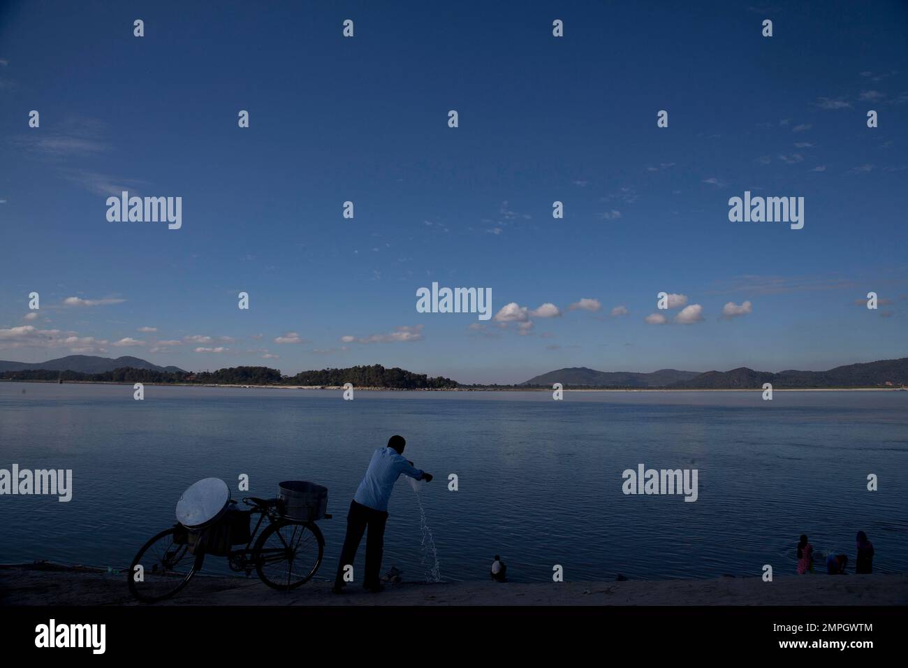 In this Monday, Dec.11, 2017 photo, an Indian fish seller cleans his ...