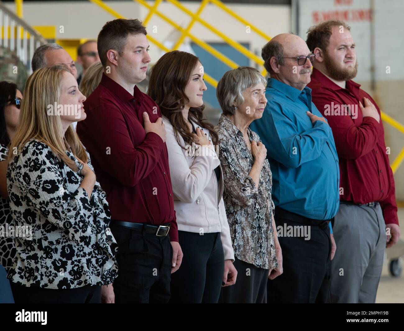 Family members of Chief Master Sgt. Marvin Boyd stand for the playing ...