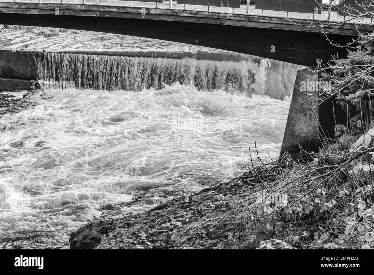 A waterfall under a walking bridge in Tumwater, Washington Stock Photo ...