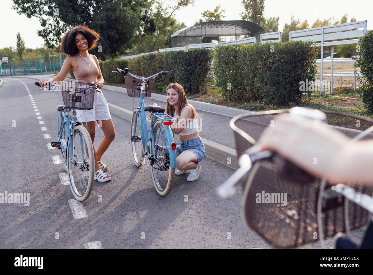 Teenagers of different nationalities and appearance on bicycles ride ...