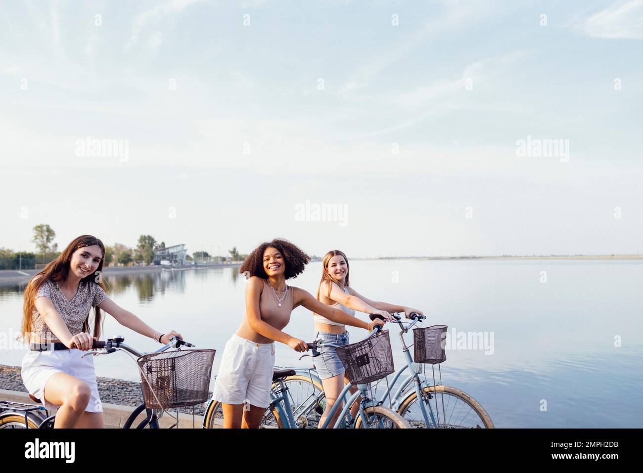 Teenagers of different nationalities and appearance on bicycles ride ...