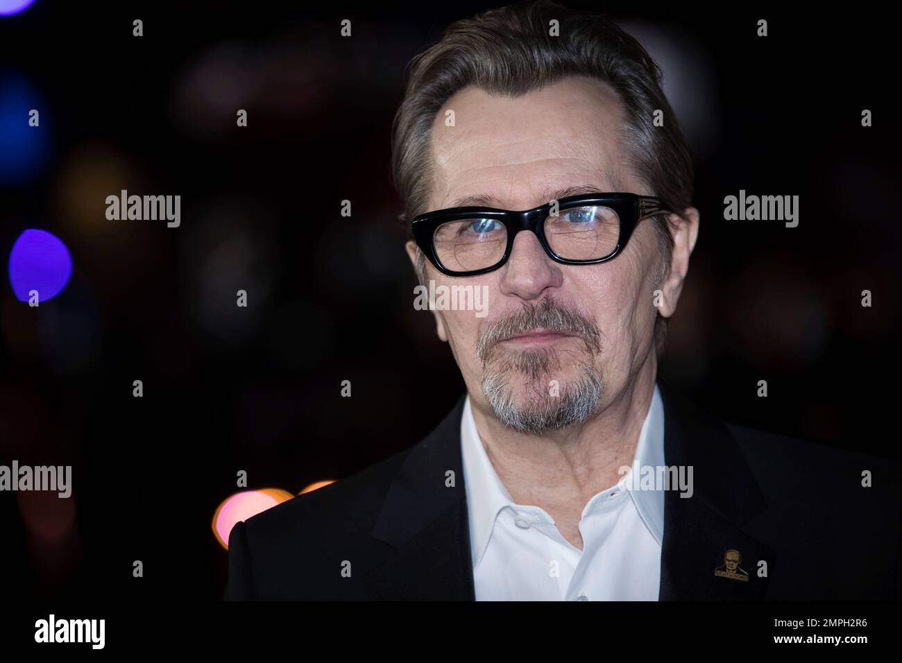 Actor Gary Oldman poses for photographers upon arrival at the premiere ...
