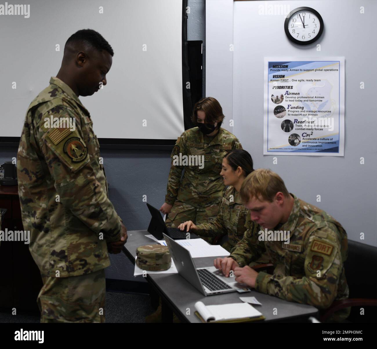 Air Force Reservists assigned to the 36th Aerial Port Squadron review a ...