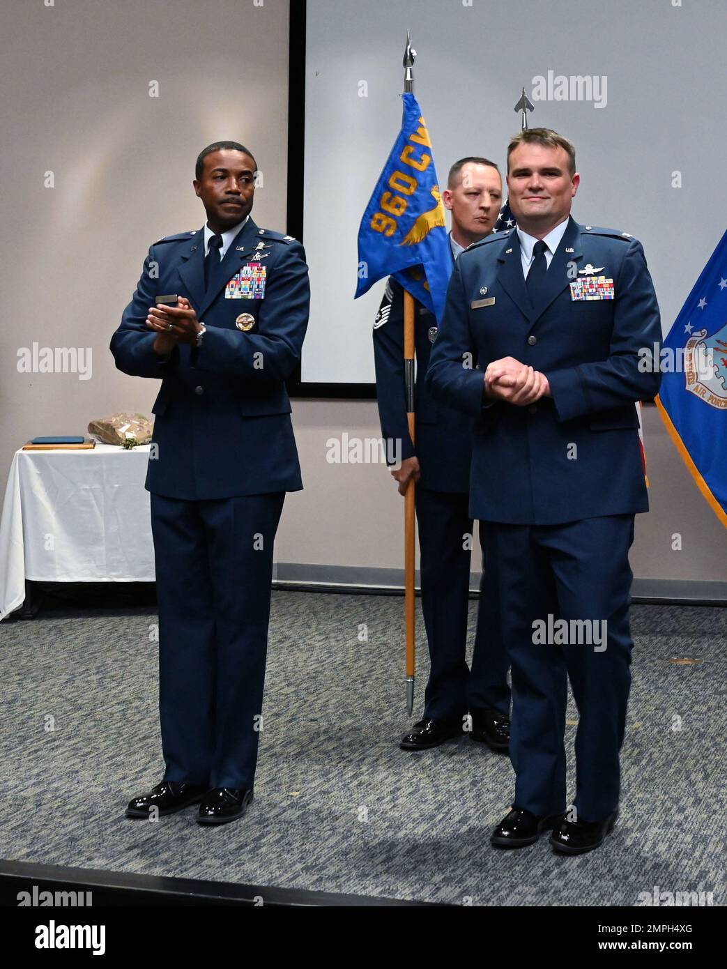 Col. Silas Darden, 960th Cyberspace Wing vice commander, claps after ...