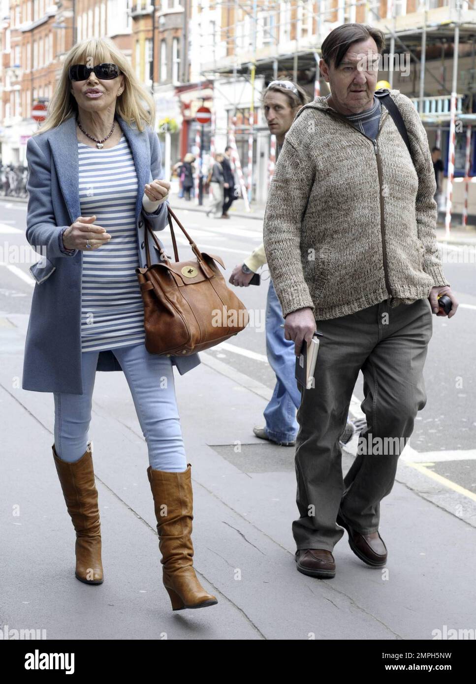 With bandages covering her left hand, actress Britt Eckland leaves the ...