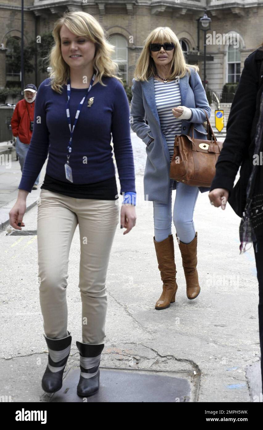 With bandages covering her left hand, actress Britt Eckland leaves the ...