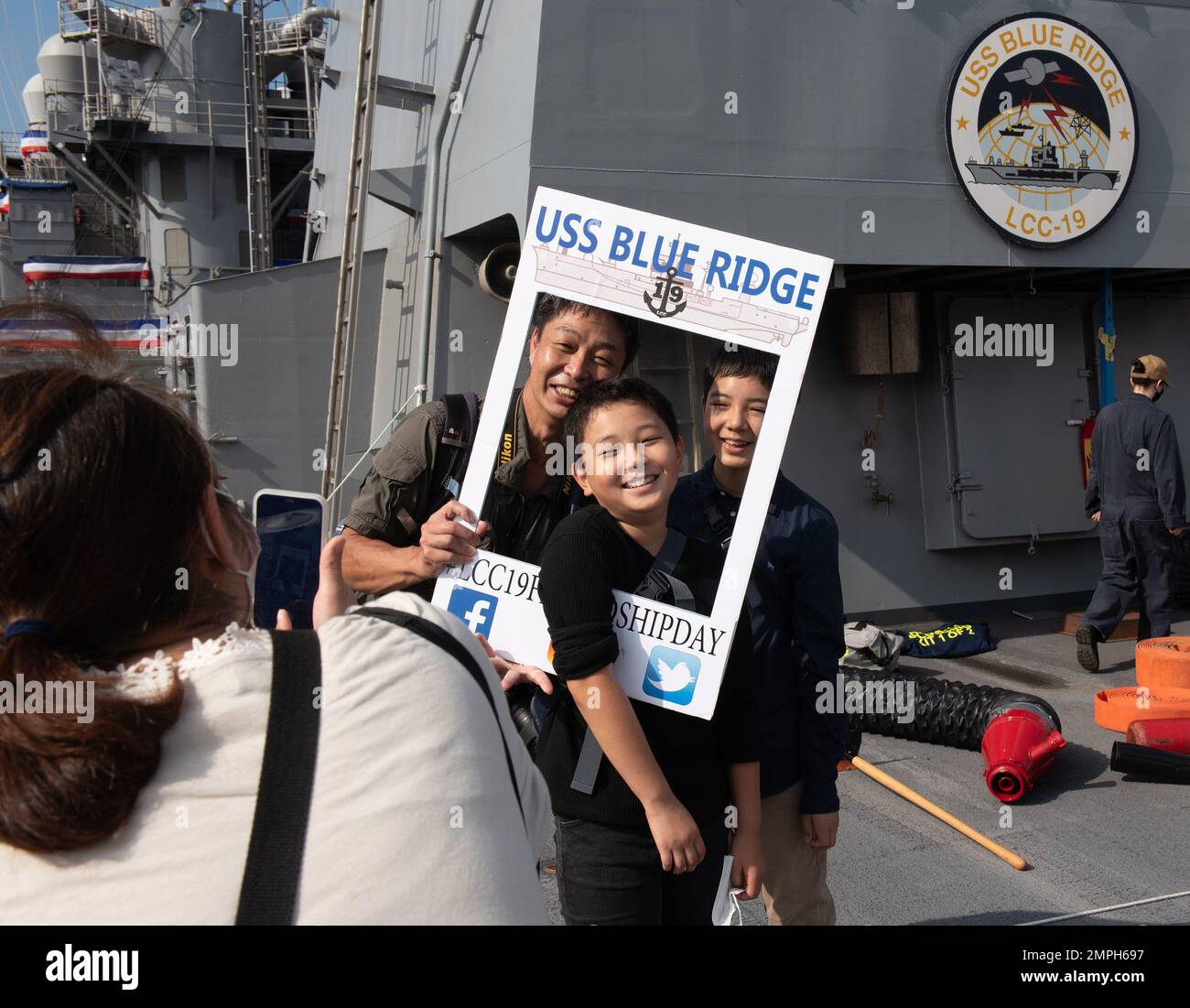 YOKOSUKA, Japan (Oct. 16, 2022) - Japanese visitors pose for a photo ...
