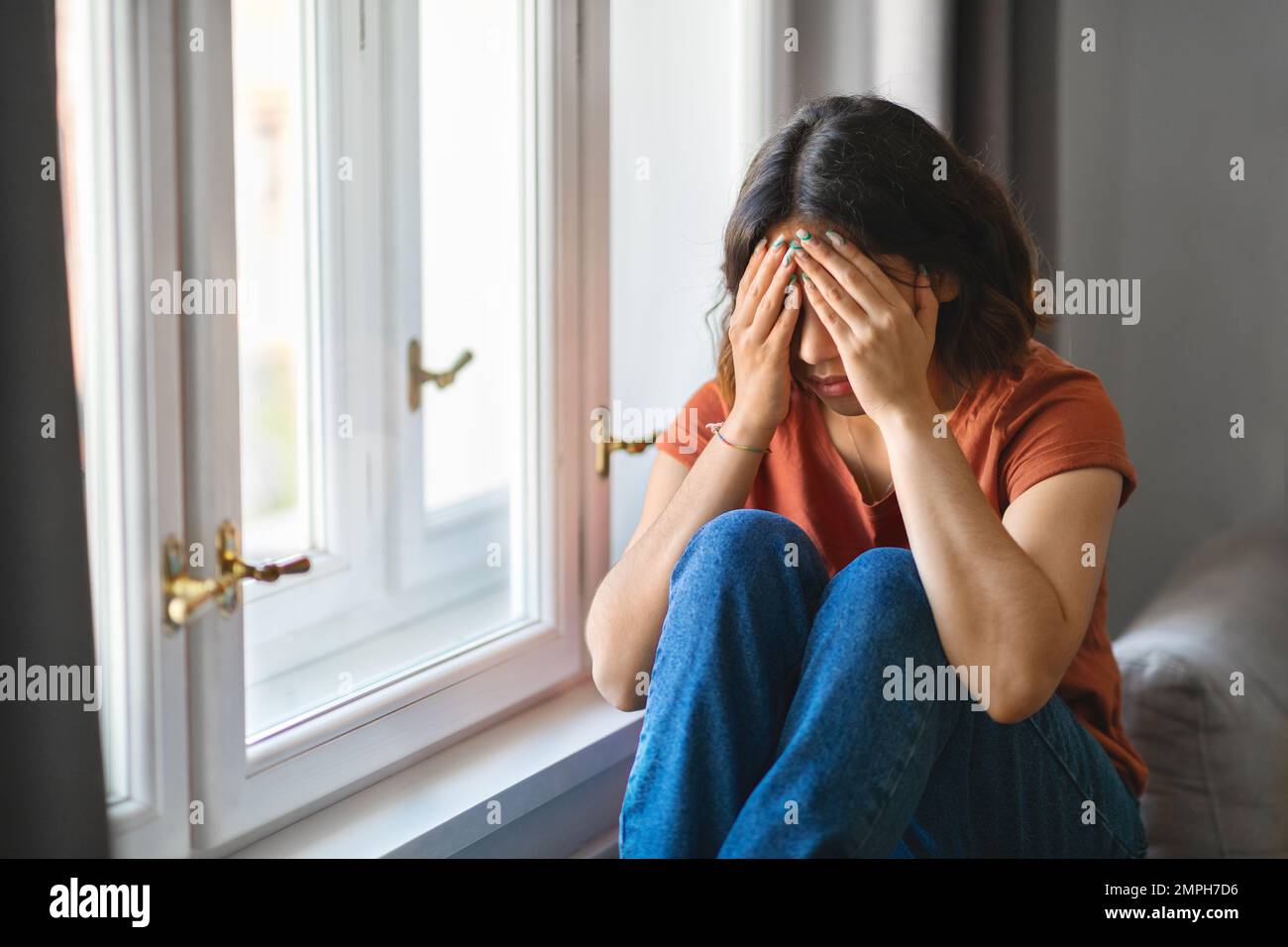 Depression Concept. Young Arab Woman Crying While Sitting Near Window ...