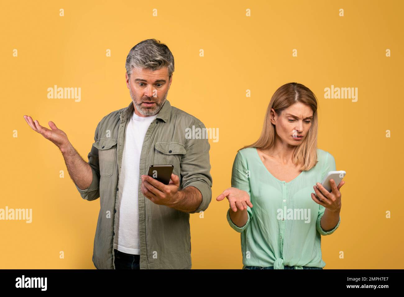 Internet connection problem. Confused middle aged caucasian couple ...