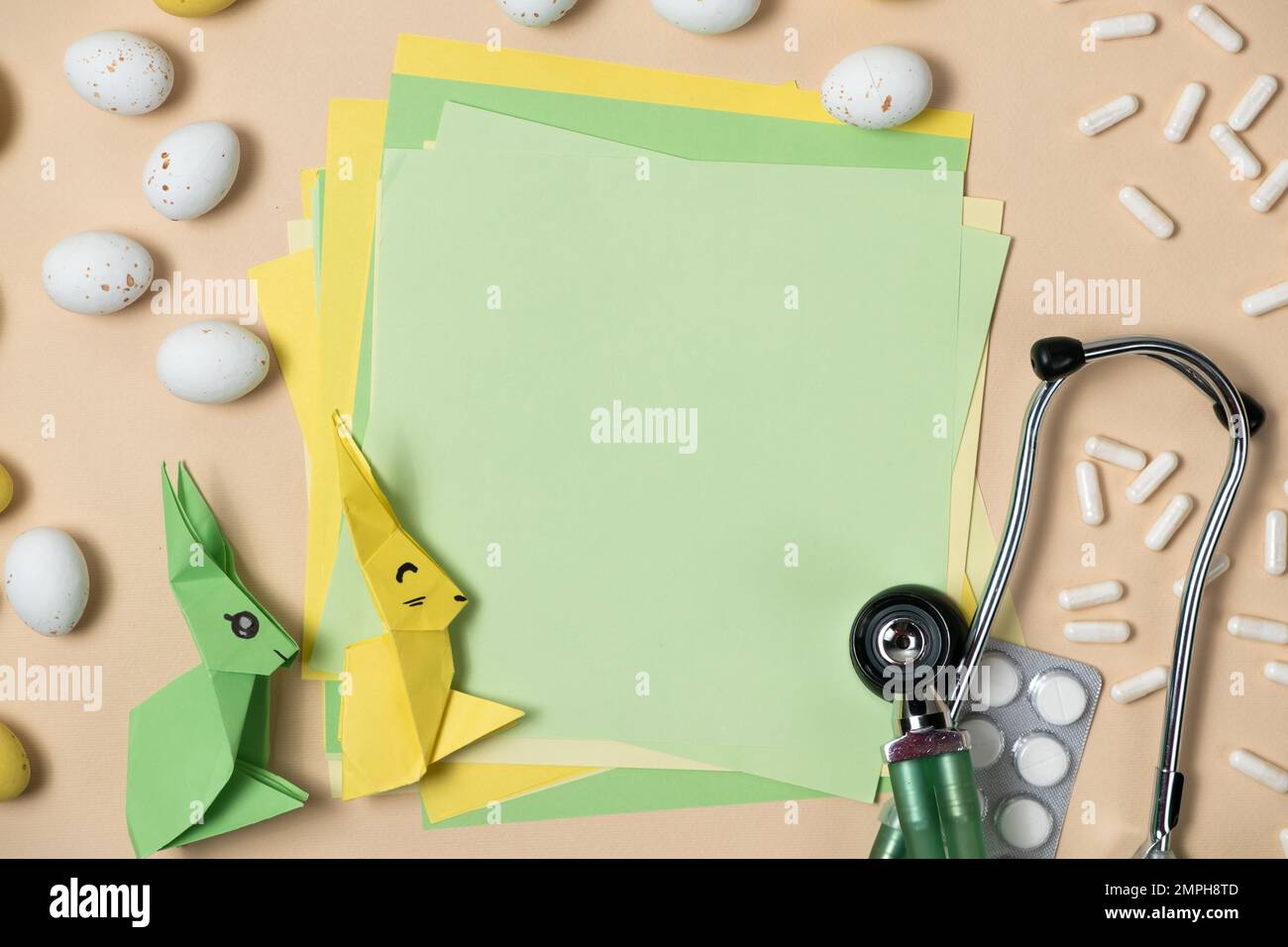 Happy and healthy Easter - medical mockup with stethoscope and pills ...