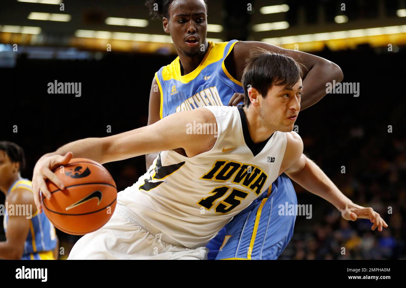 Iowa forward Ryan Kriener (15) drives past Southern University's Ali ...