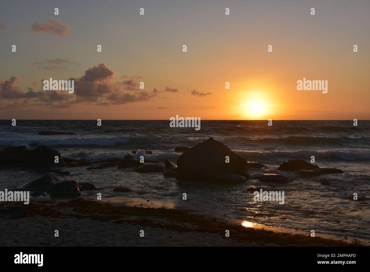 Gorgeous burning orange sunrise over the ocean waters in Aruba Stock ...